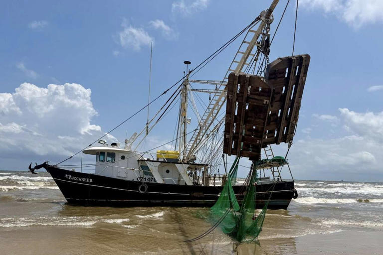A stranded shrimp boat has become the latest spectacle on the Texas coast