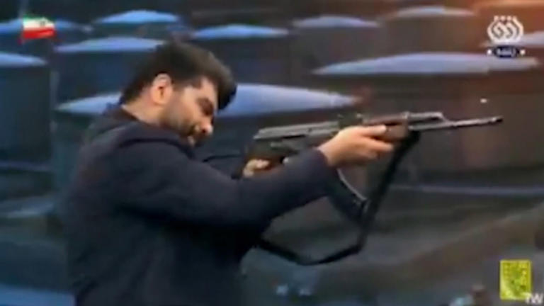 Iranian TV reporter fires gun at UAE flag during live broadcast