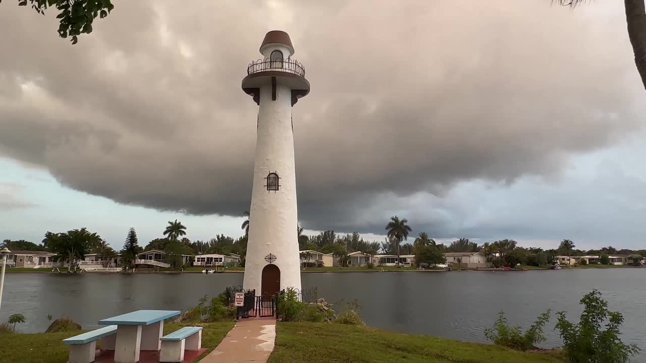 Eerie calm before the storm: Dark clouds loom over Dania Beach lakeside