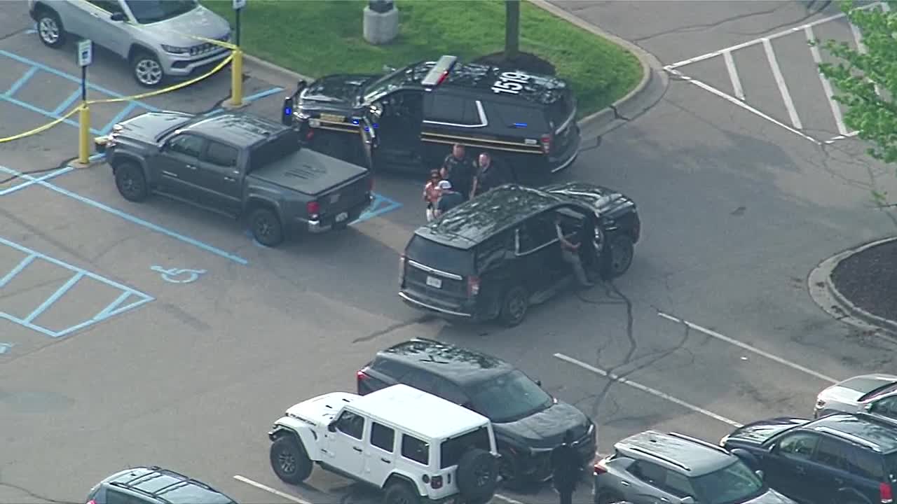 Chopper 7 over carjacking and shooting scene in Orion Township