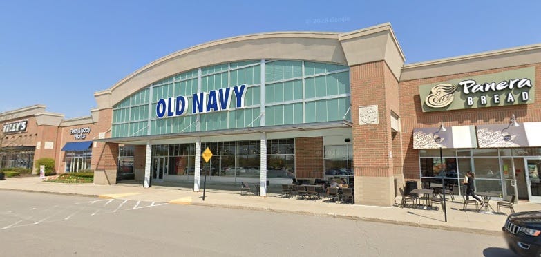 Female shot in carjacking at Orion Township store; 1 in custody