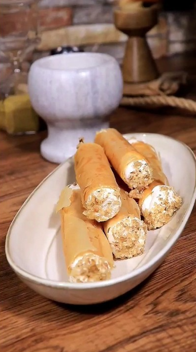 Crispy cannoli filled with creamy tiramisu filling