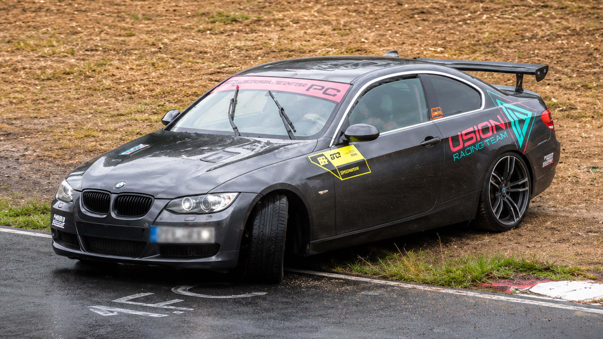Vehicle left racing line near slippery Nürburgring corner entry area