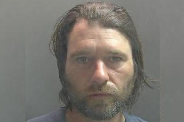 Police look for wanted man who 'flouted order not to enter area'