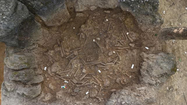 Archaeologists excavated a giant stone jar and found a grim surprise
