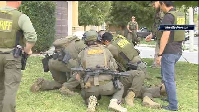 Wanted man barricades himself on house roof for hours