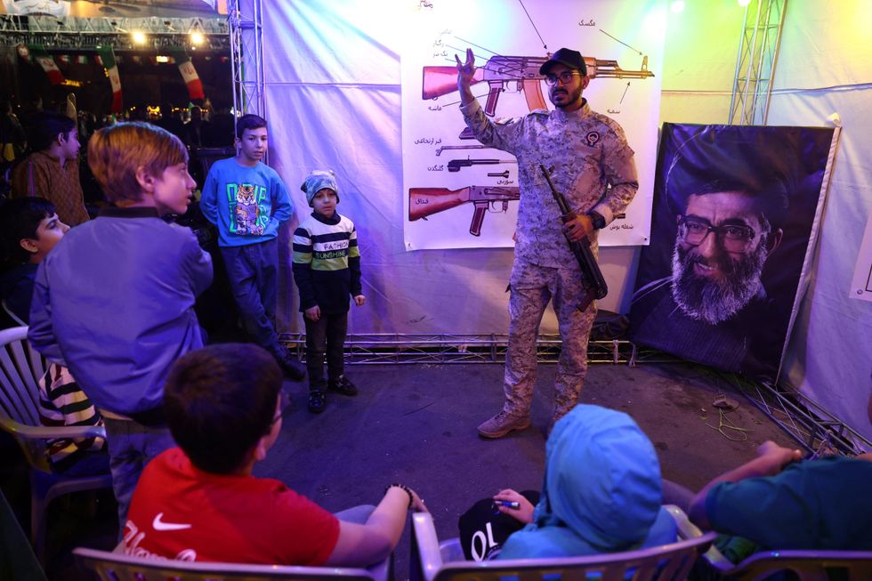 Iran caught teaching children how to use AK-47s - while Ayatollah ...