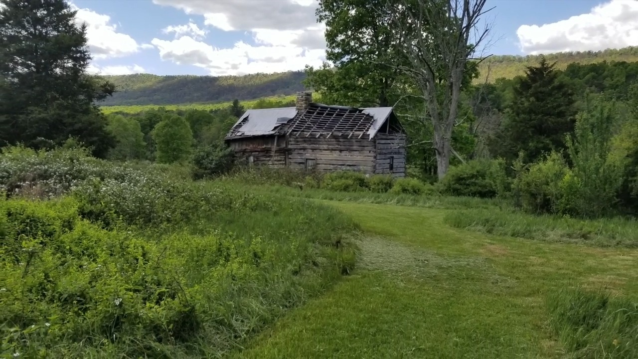 This 1700s log cabin is falling apart - but the door still has its evil ...