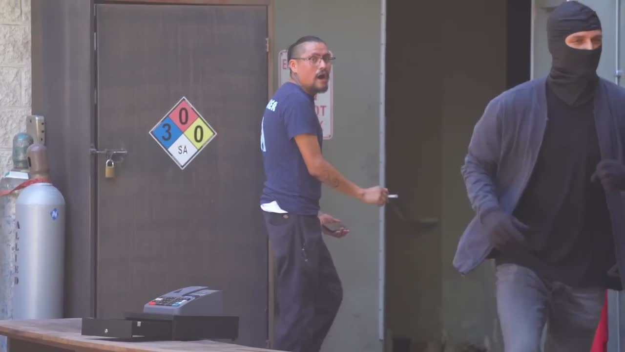 Strangers left in shock after being offered money by a bank robber