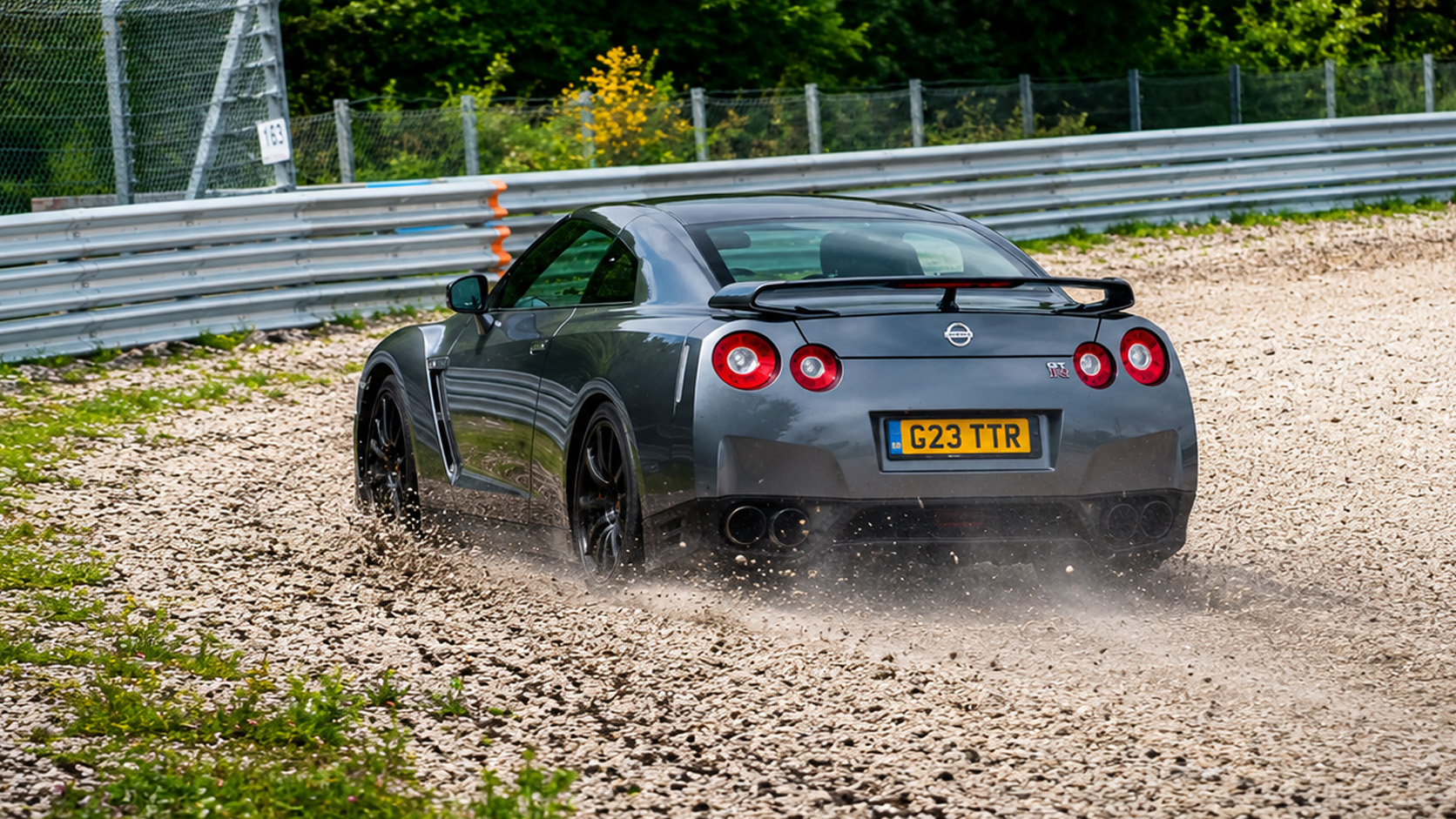 Nissan GTR nearly crashes after sudden brake failure into the gravel