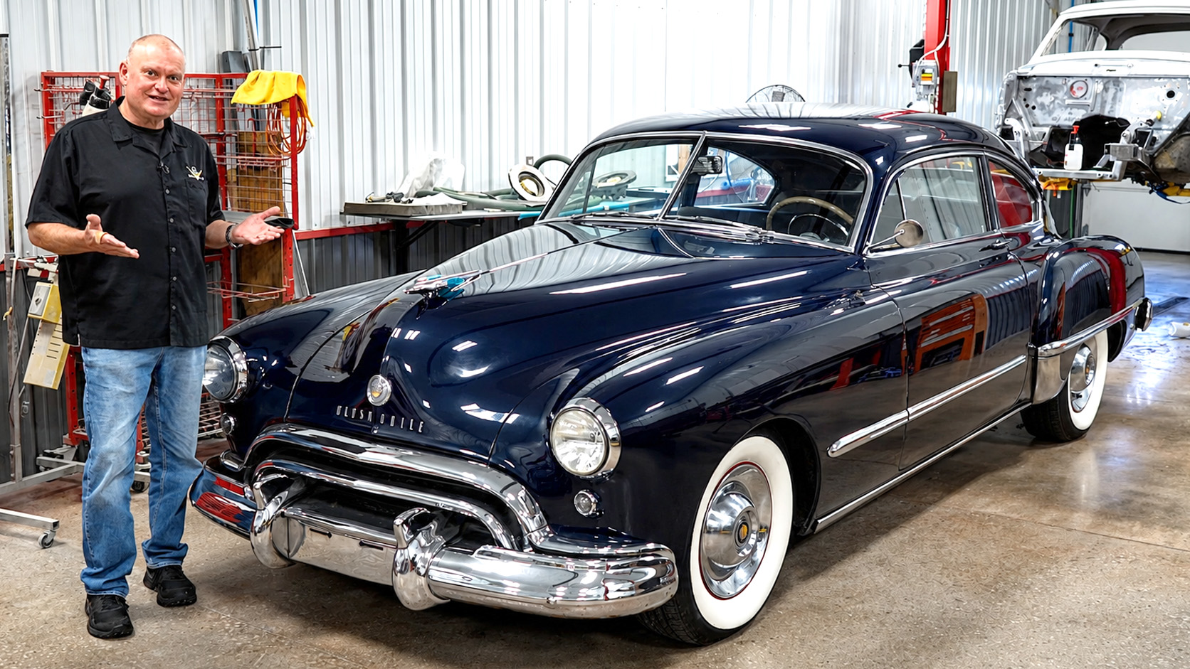This Oldsmobile blends low-slung style with whitewall elegance