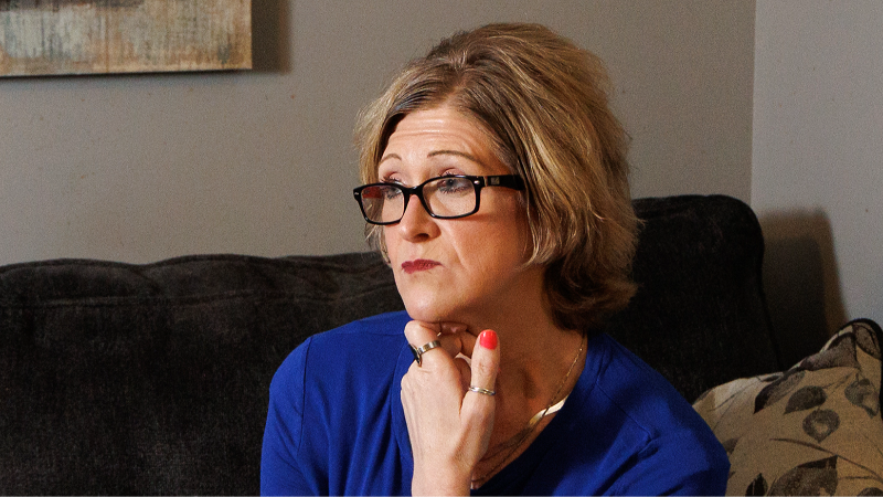 Former employee says insurance chief sought to kiss her. He denies.
