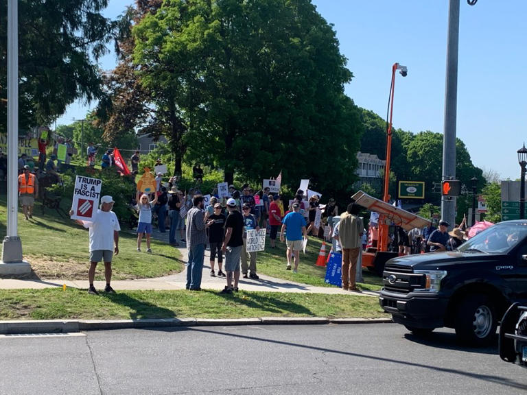 A hundred protesters gather outside Coast Guard Academy ahead of ...