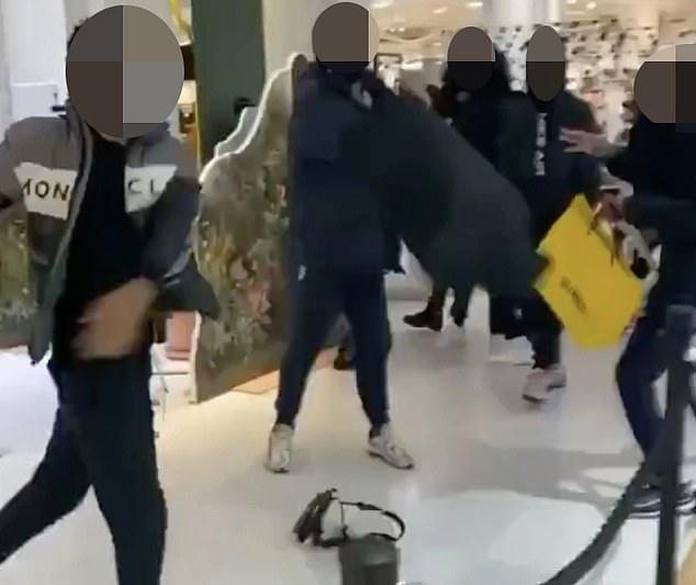 Brawl breaks out at Selfridges as men kick, punch and wrestle while ...