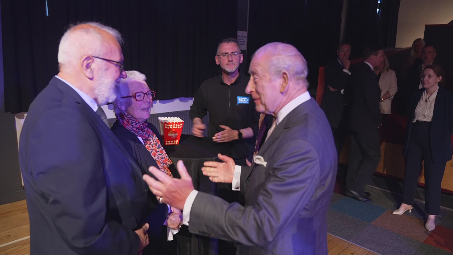 King Charles speaks with deaf actors during NI cinema visit