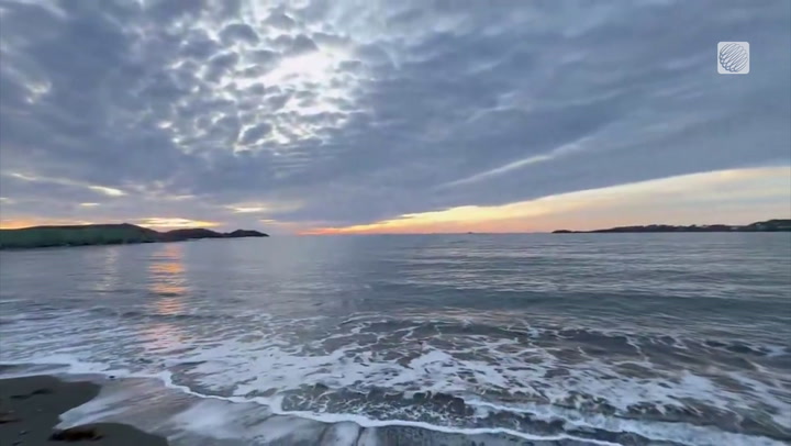 A stunning cloud laced sunset over Long Beach in Bonavista, NL