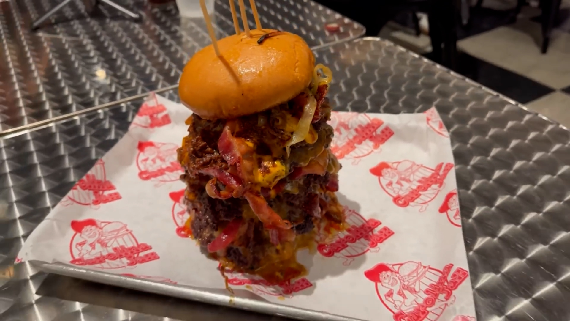 Guy tries to survive undefeated smash burger food challenge