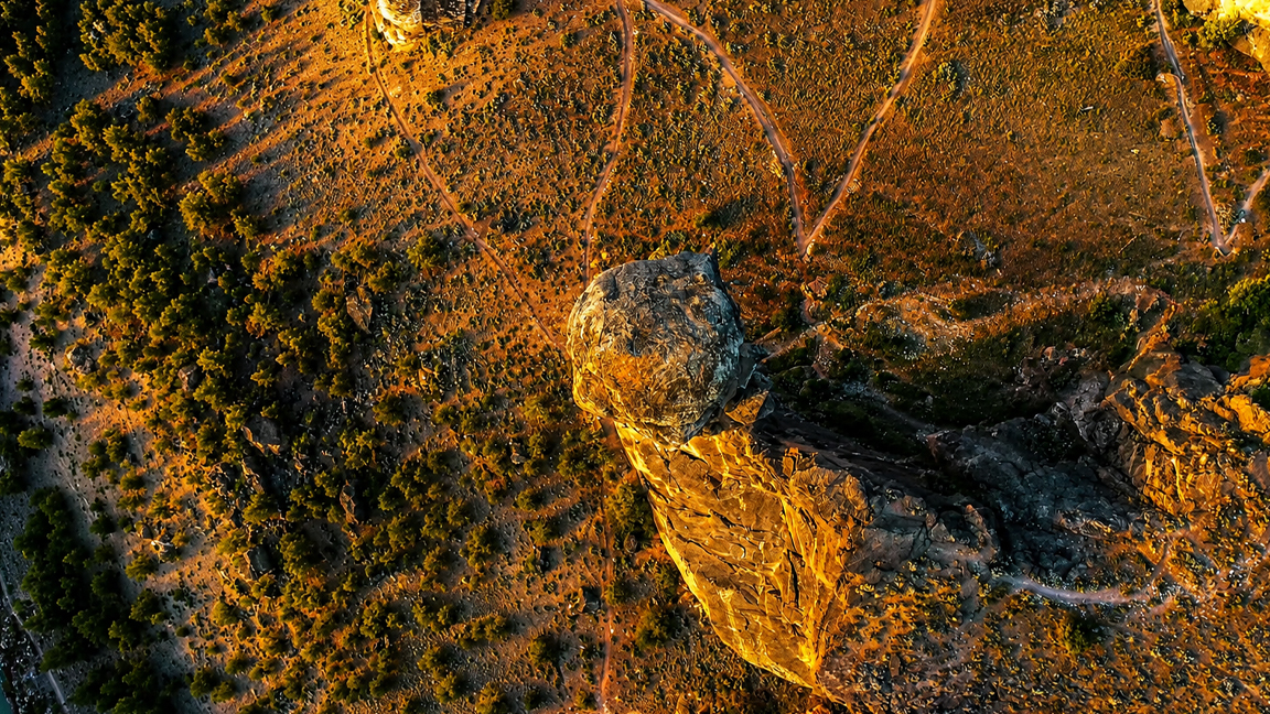 Unique natural monolith surrounded by desert trails