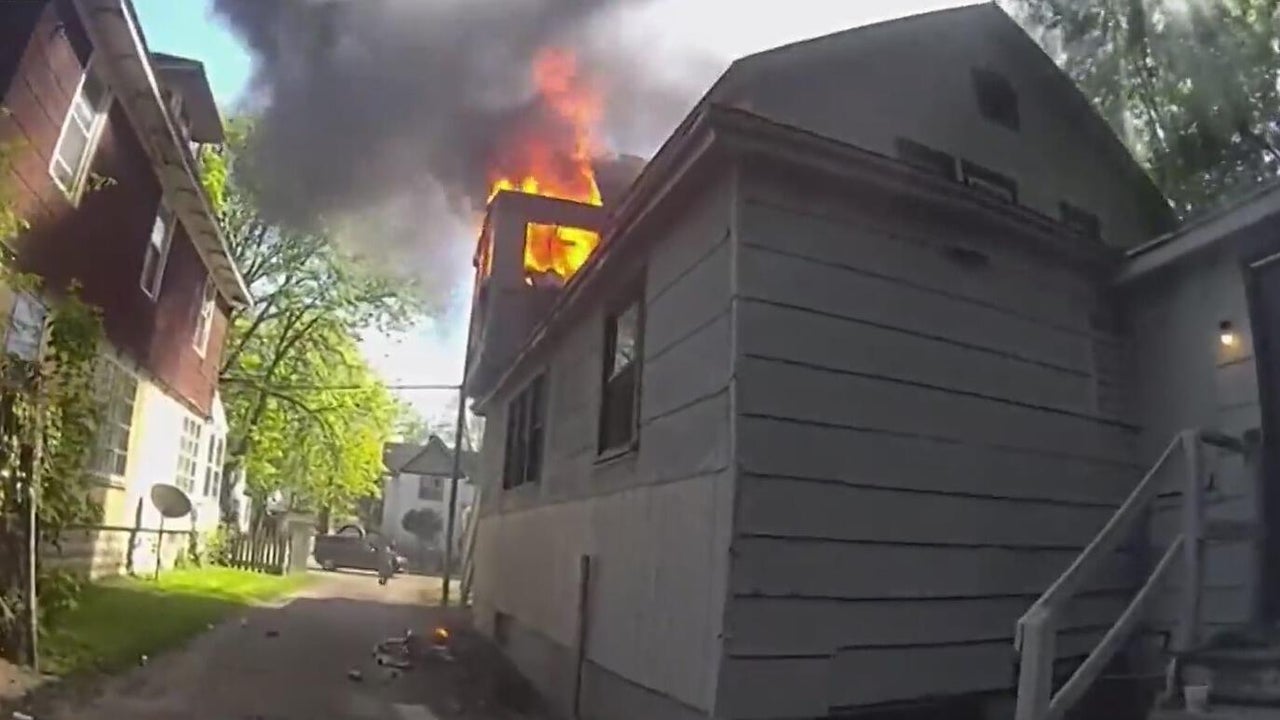 Kalamazoo officer catches baby tossed from burning home