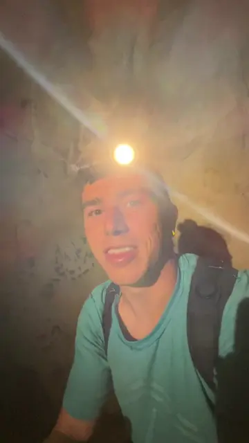 Inside the hidden cave with a volleyball court and museum
