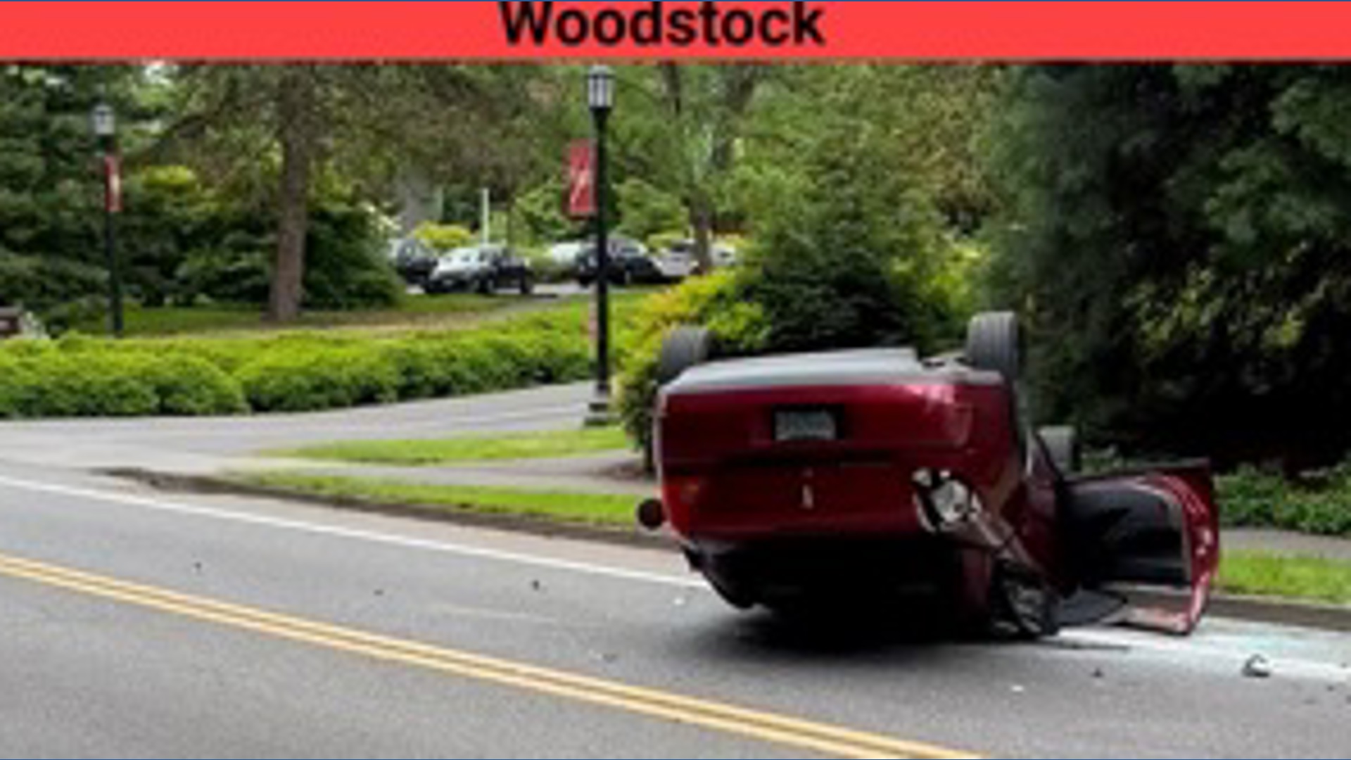 Upside-down car blocks lane of traffic in Southeast Portland