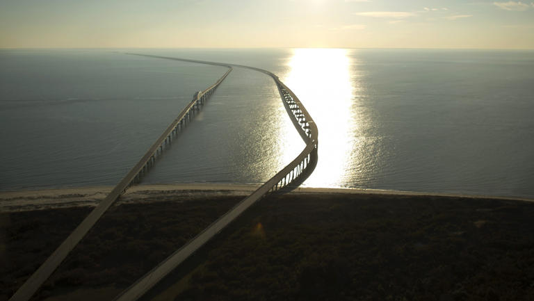 Chesapeake Bay Bridge-Tunnel police vehicle flips, hangs off bridge ...