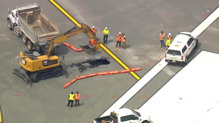 Crews work to repair large sinkhole on LaGuardia Airport runway