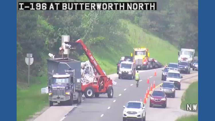 Semi truck dumps load on I-196 after Lake Michigan Drive exit, snarling ...