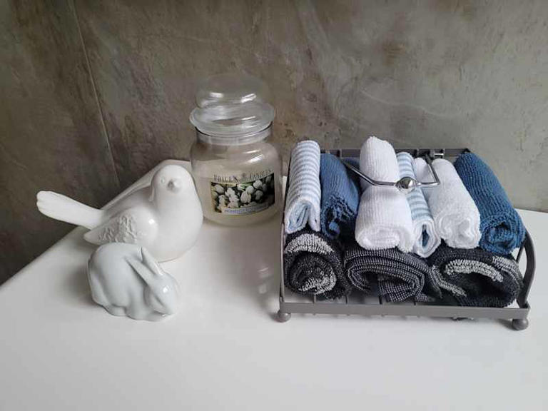 I put a wire napkin holder in my bathroom, and it's the cutest storage ...