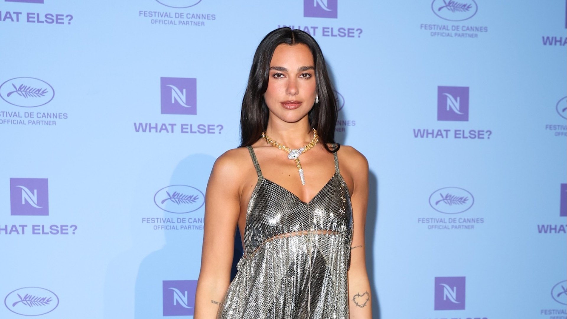 Dua Lipa shows off her bikini body in cool chrome set with diamond jewelry