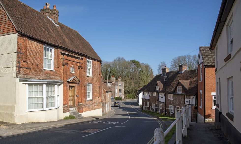 Fearful village forced to shut up shop while hundreds of travellers ...