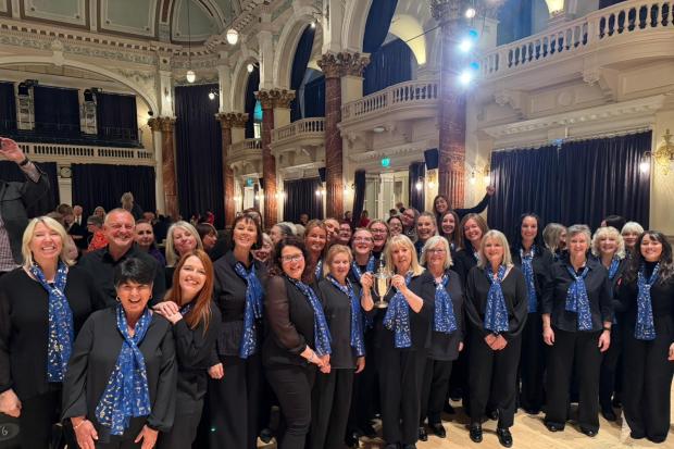 Choir celebrating after winning another trophy at performing arts festival