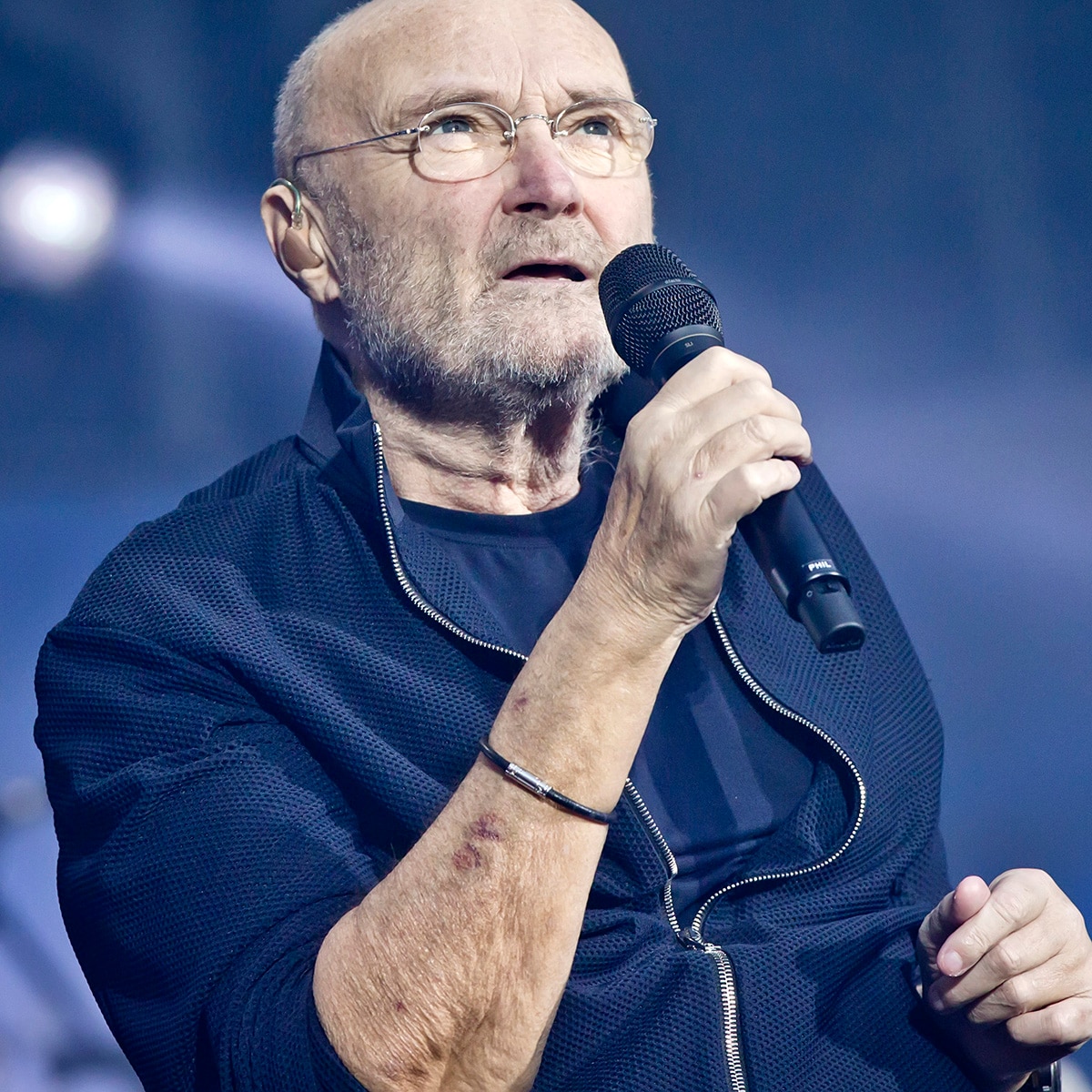 Phil Collins steps out with crutches during rare public appearance