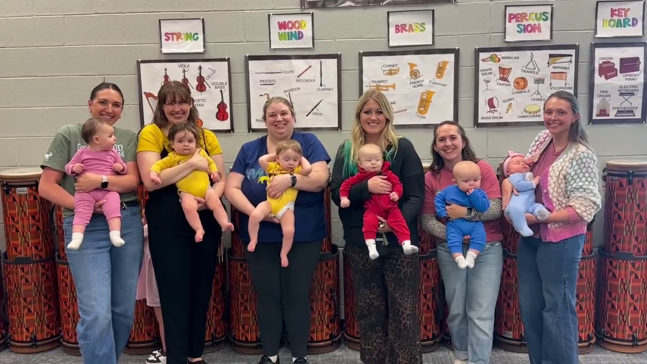 Six Derby elementary staff show off their babies at talent show
