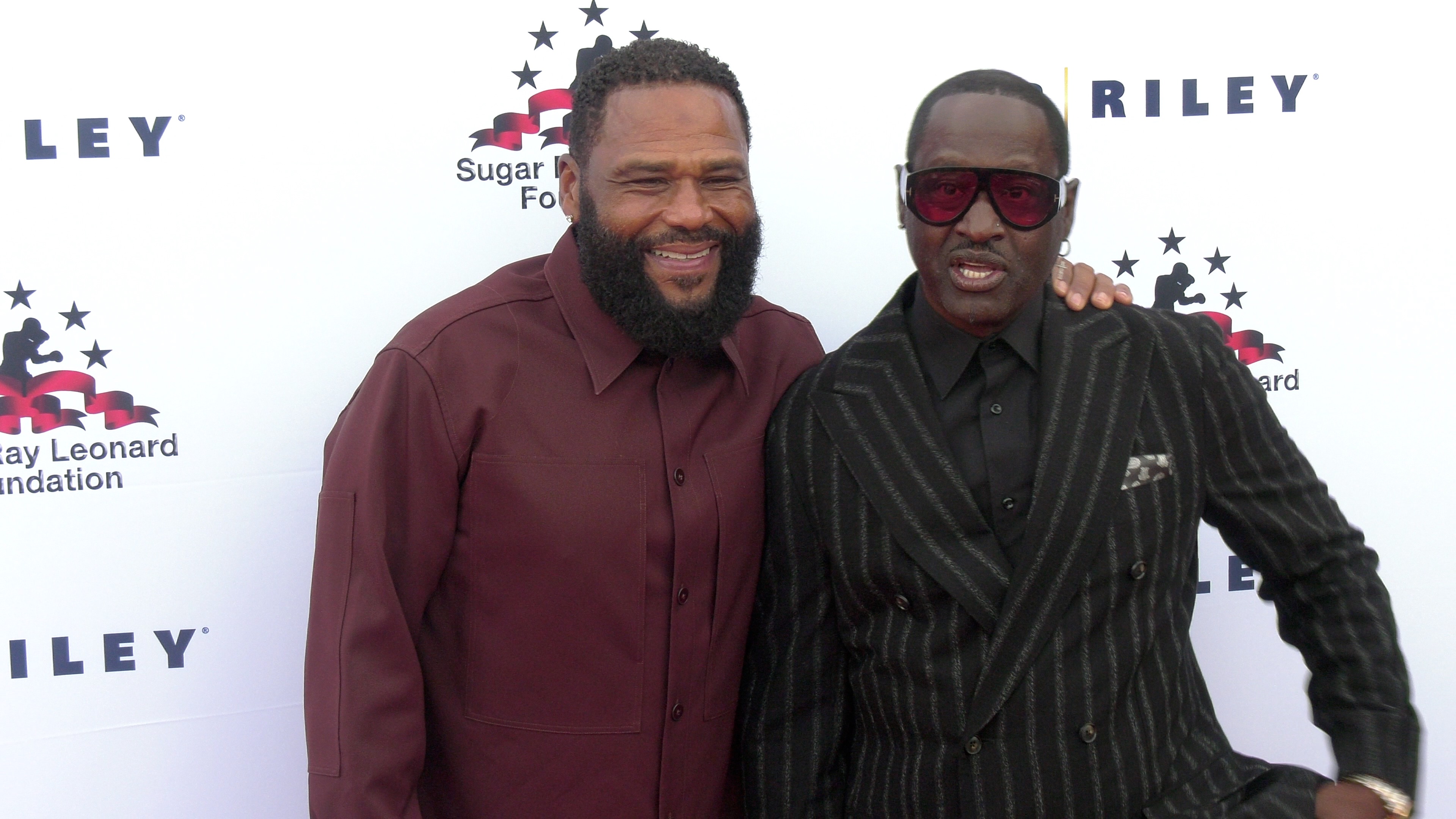 Anthony Anderson and Johnny Gill attend the Sugar Ray Leonard ...
