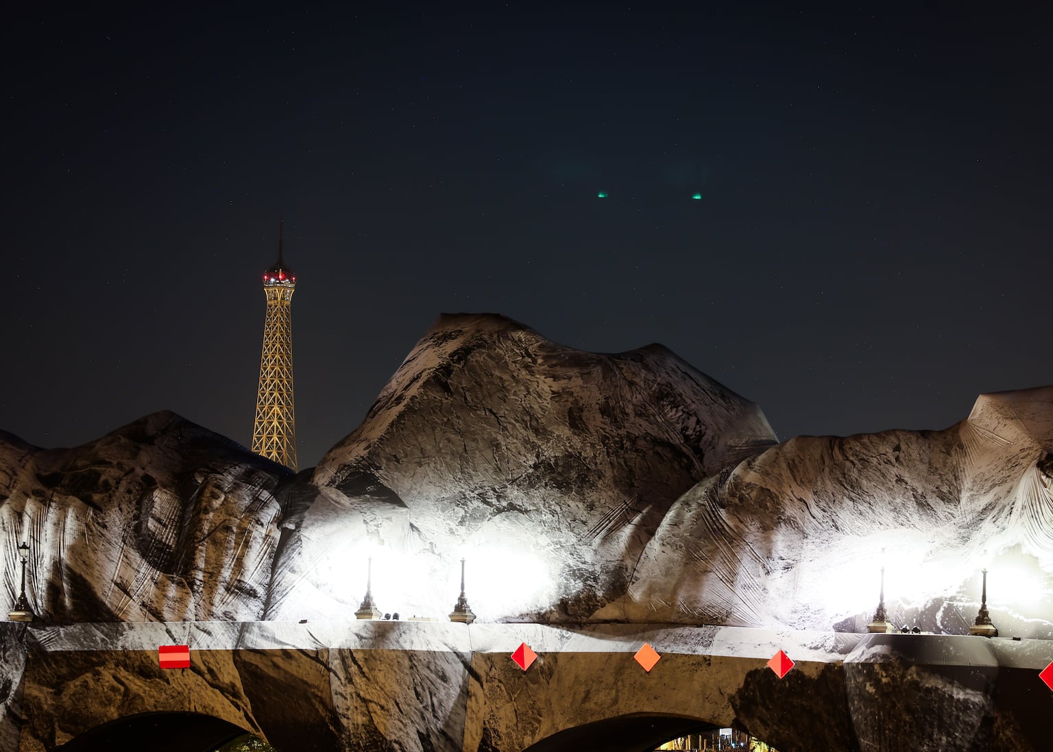 French artist JR begins his giant 'cave' art inflation over Paris ...