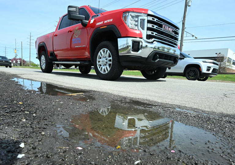 Potholes, crashes, sky-high insurance make driving in SE Michigan a drag