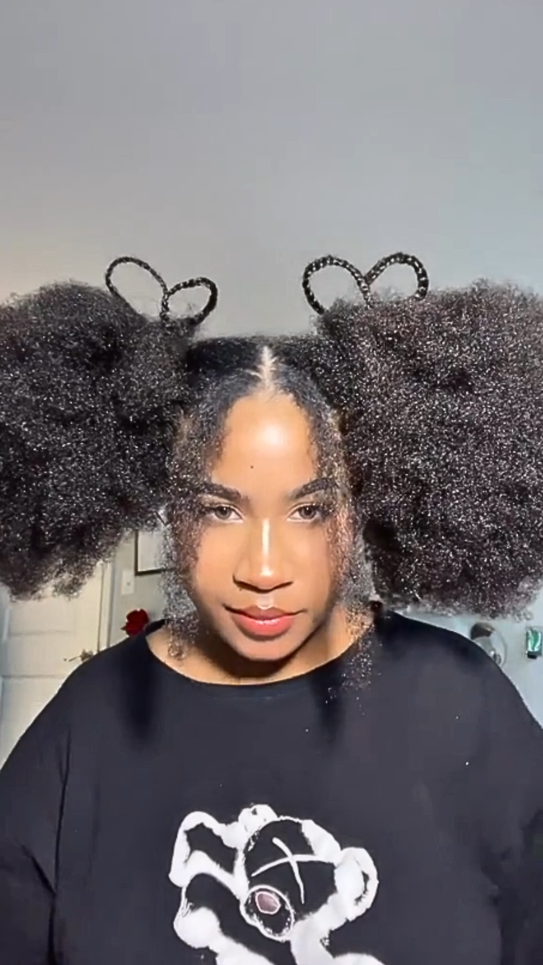 Trying creative Afro hairstyles with heart design
