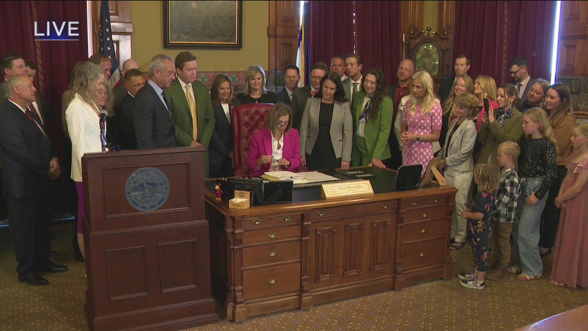 Gov. Reynolds signs Iowa MAHA law alongside Secretary RFK Jr.
