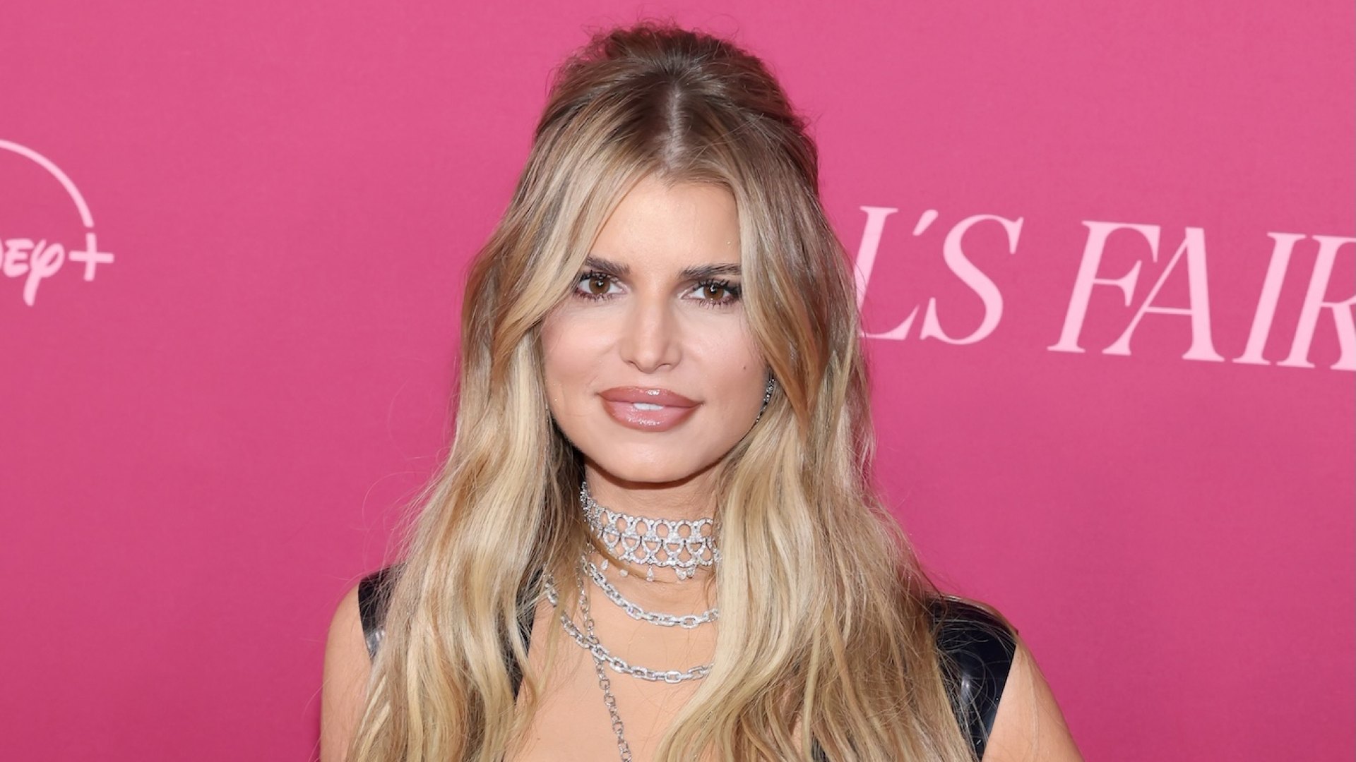 Jessica Simpson defends flying 1st class with her 3 kids in coach