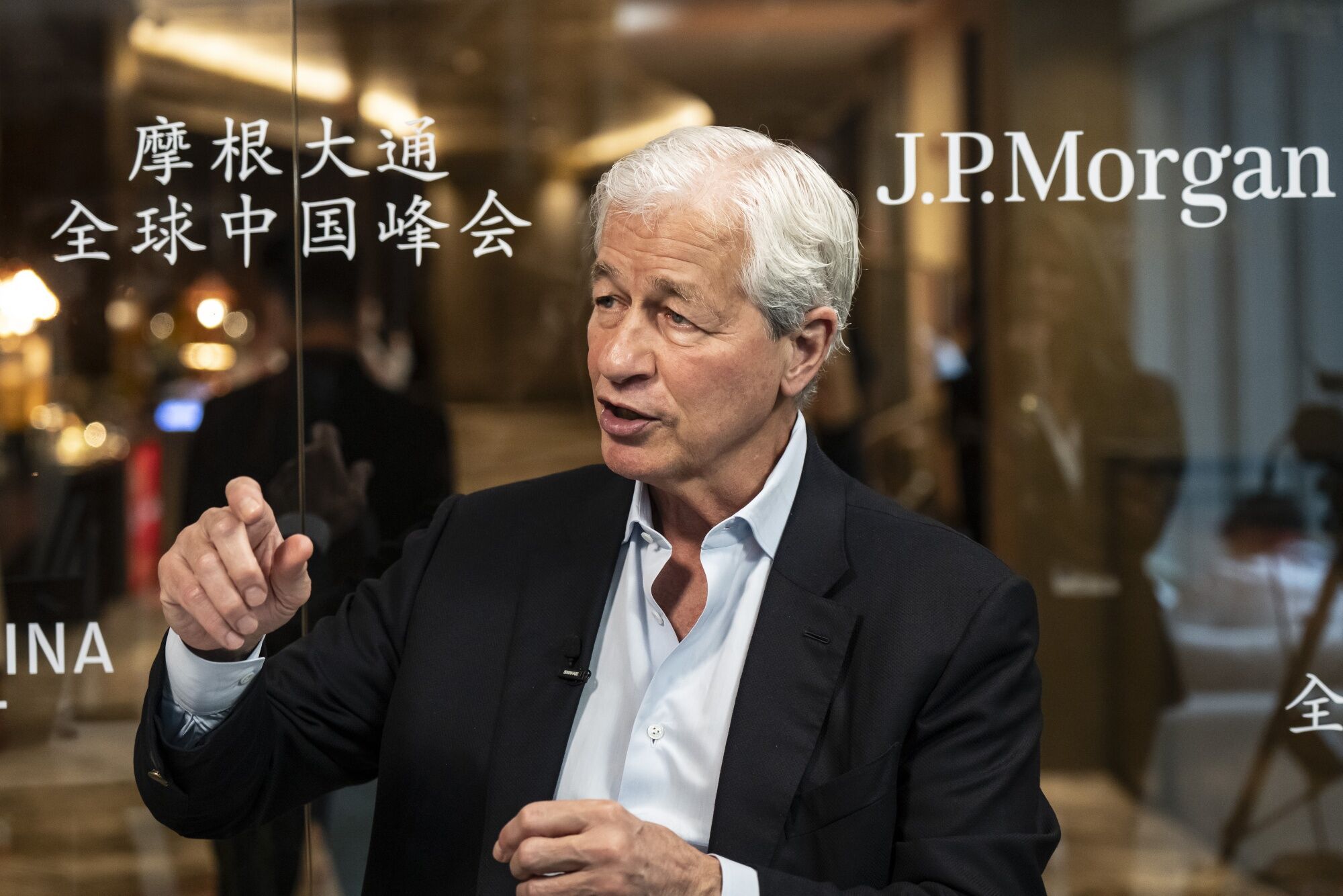 Dimon says JPMorgan will hire more for AI, fewer bankers