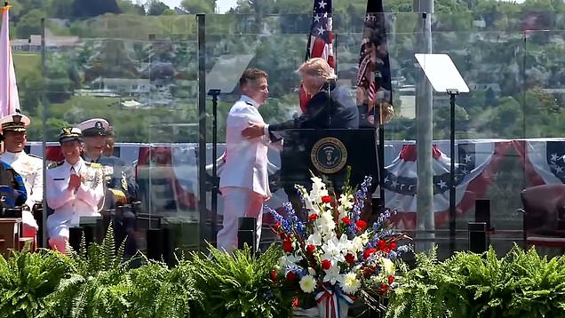 Excruciating moment Trump 'checks out' young cadets and feels their muscles