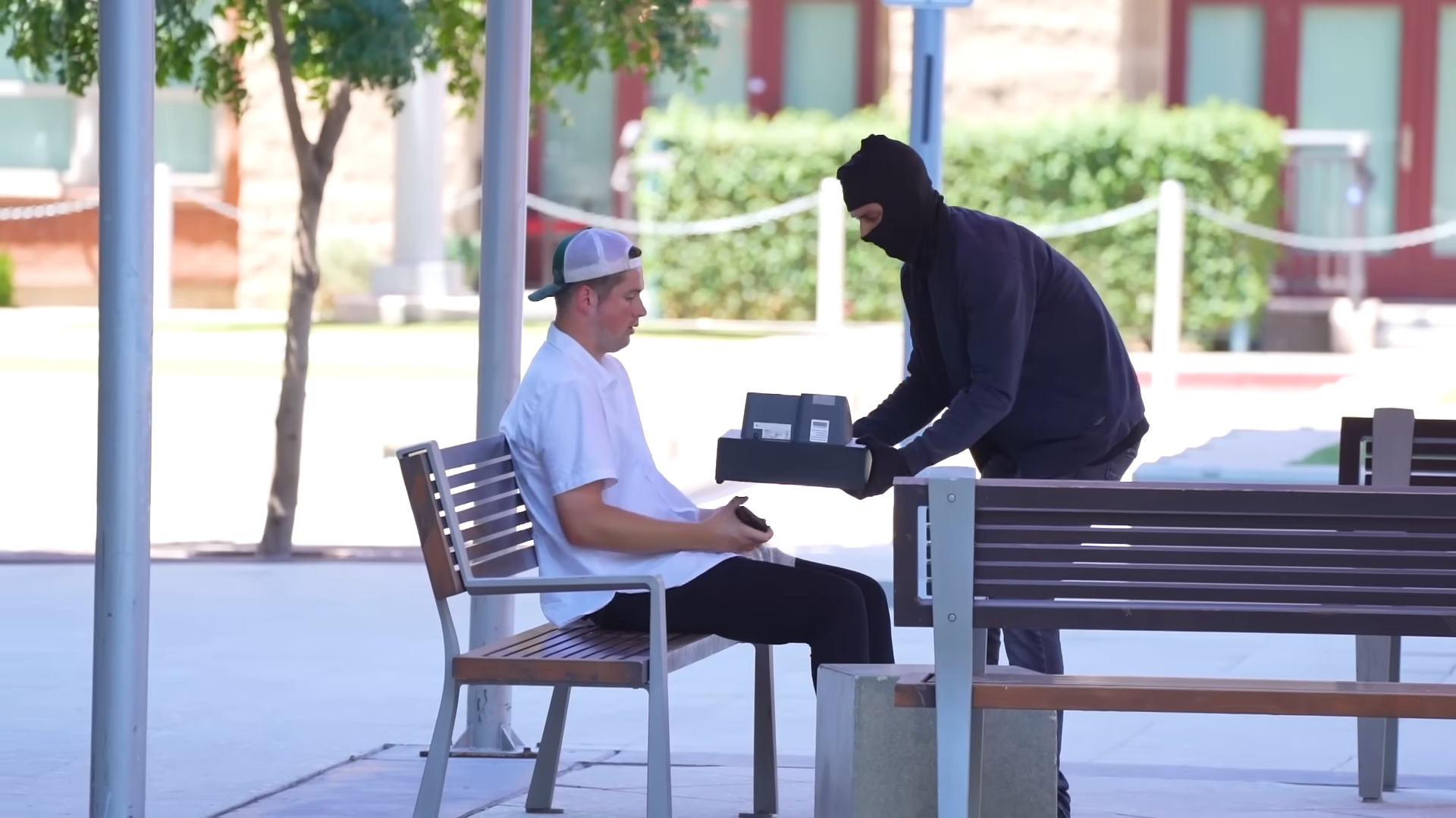 Strangers left in shock after a robber leaves them a register full of cash