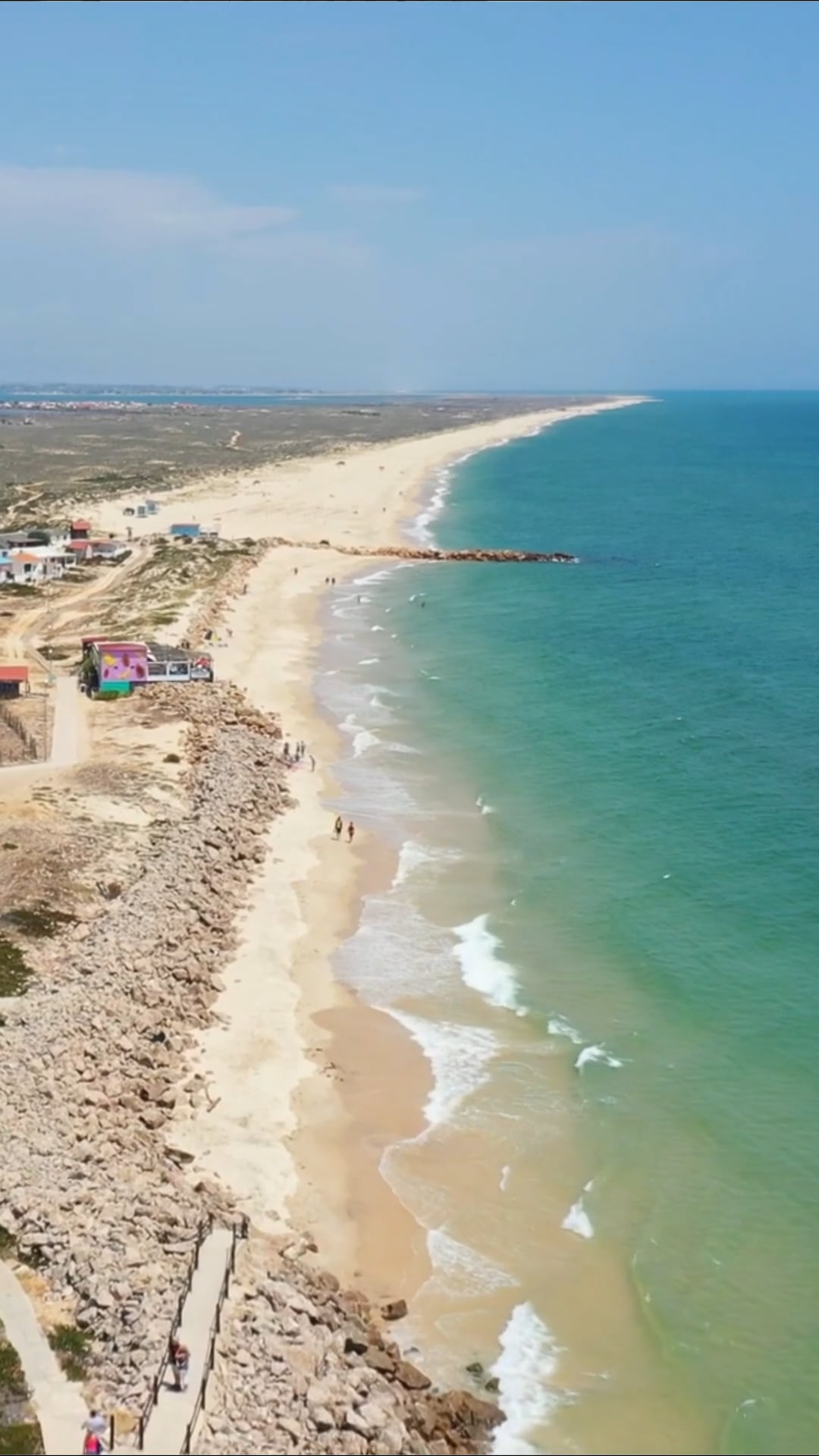 Drone flight over Ilha do Farol's stunning lighthouse & shores