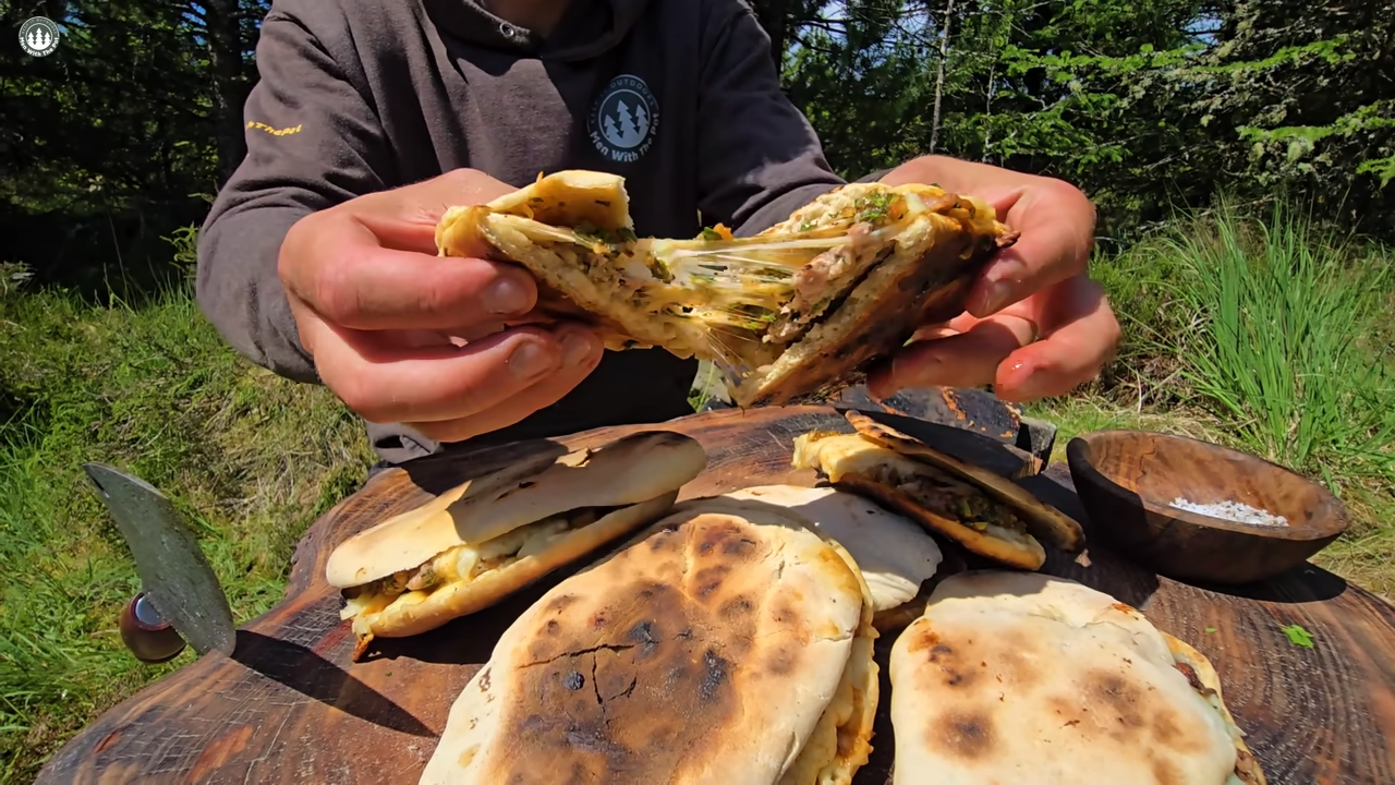 This is what happens when sausage bread meets campfire heat