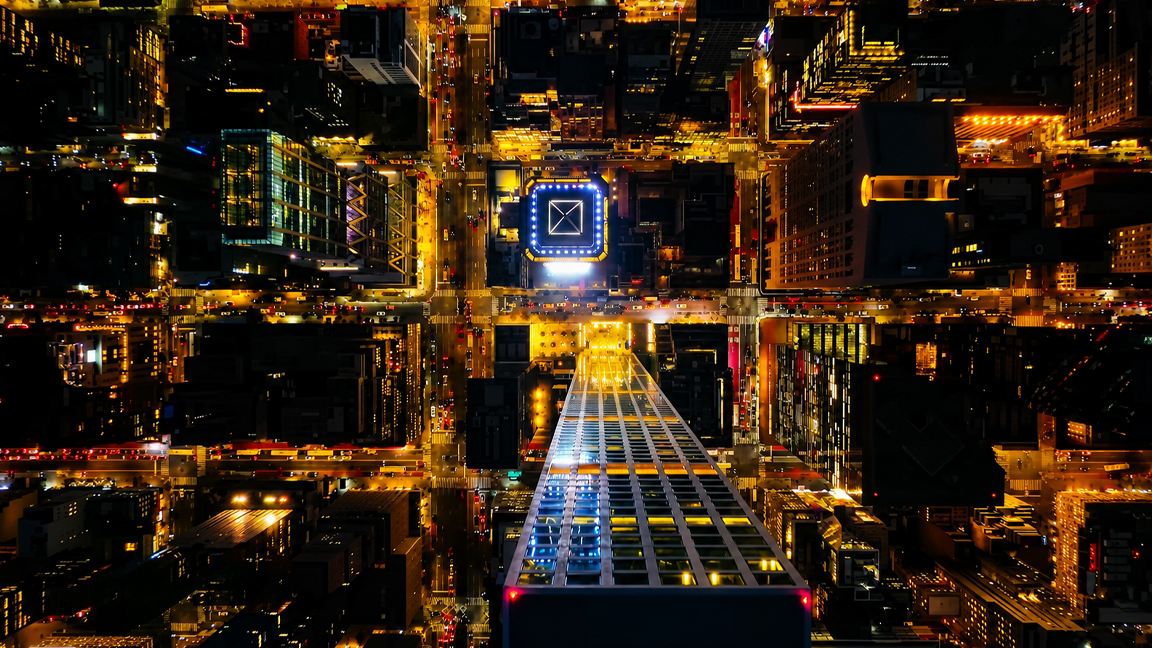 Modern downtown skyline with bright urban lights