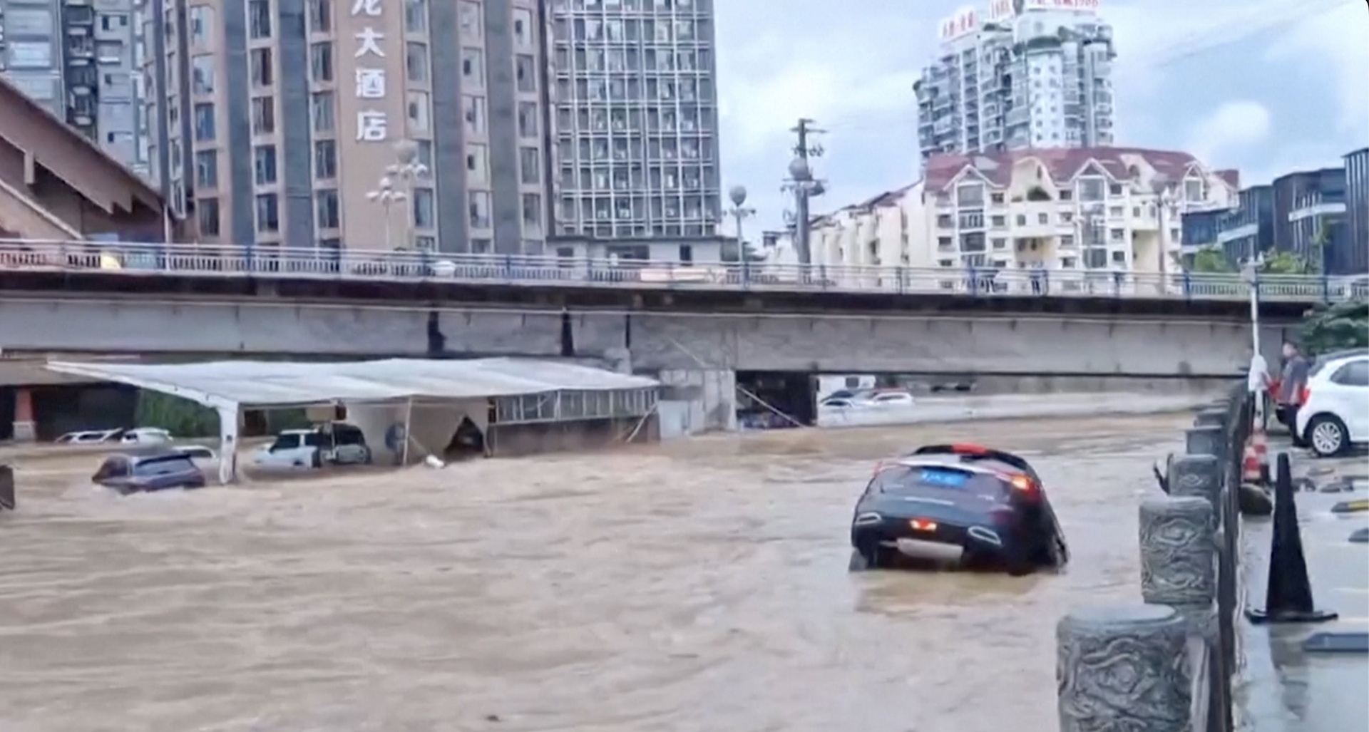 Flooding in southern China washes away cars and destroys bridge