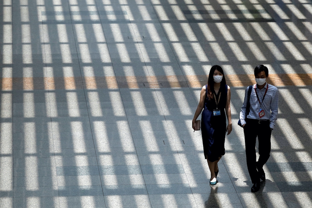 Covid-19 cases in Singapore surge nearly 60pc in a week, authorities ...