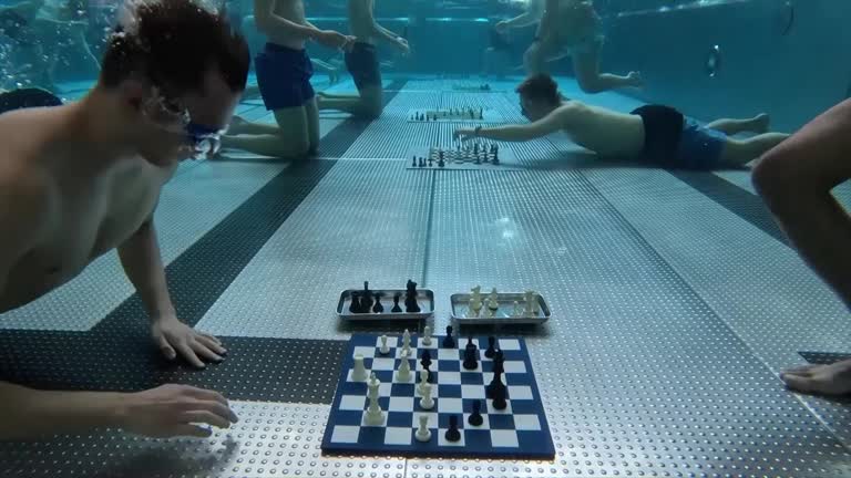 Diving chess players battle it out on underwater boards