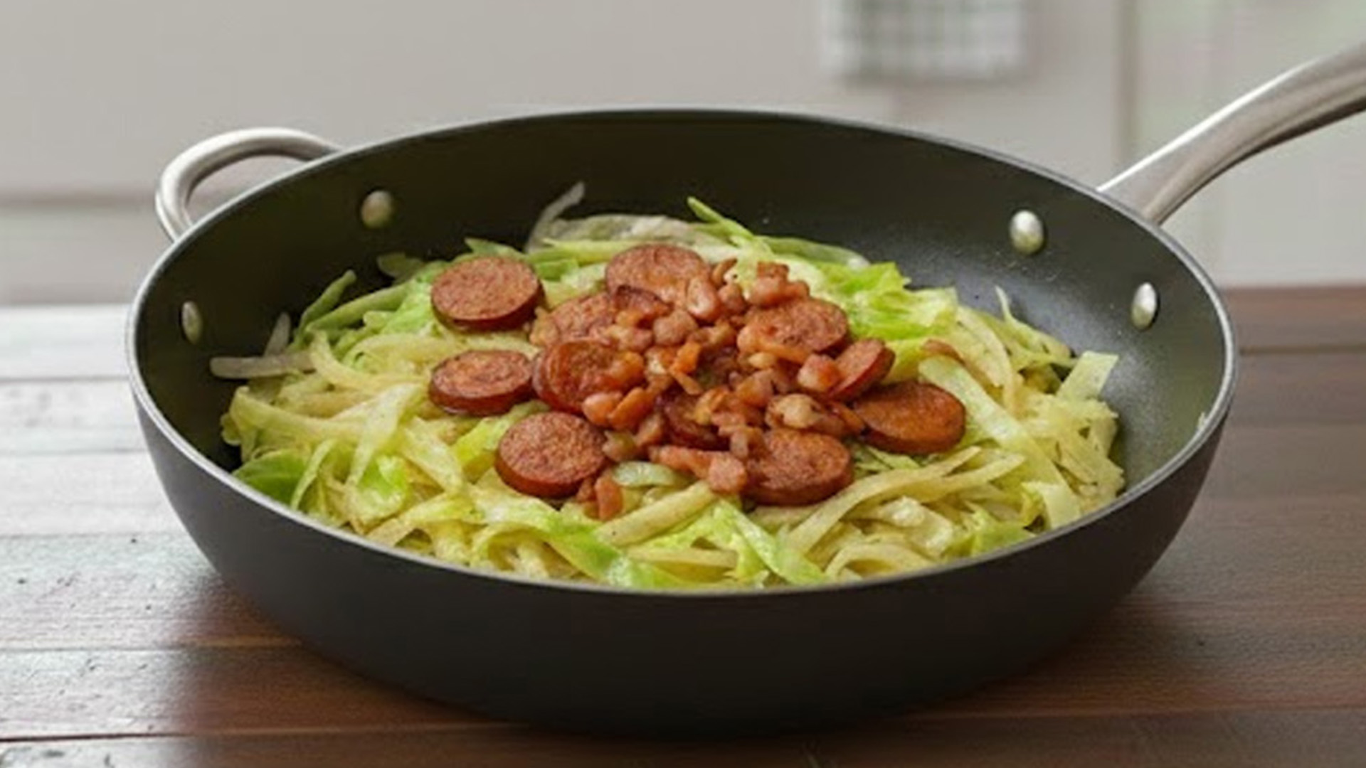 How to make fried cabbage with sausage and bacon
